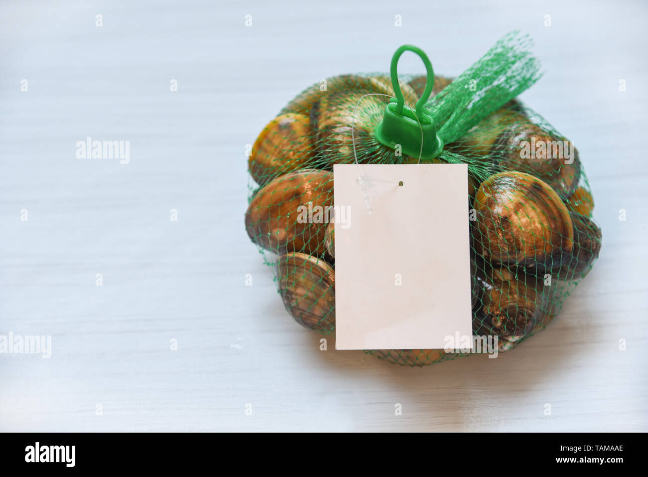 Shellfish enamel venus shell Seafood Clams on net bag in the ...