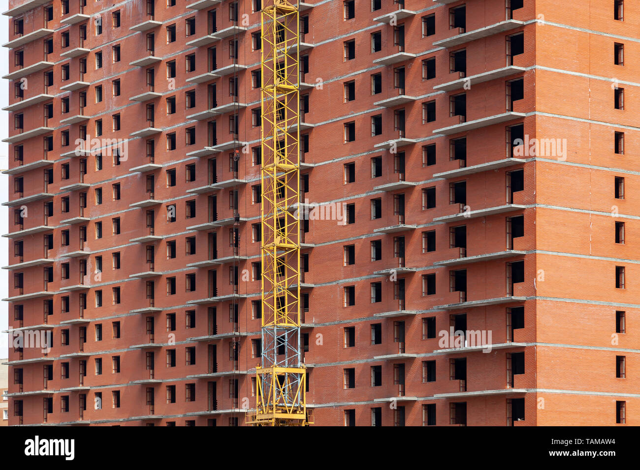 Close-up on a multi-storey residential building under construction from ...