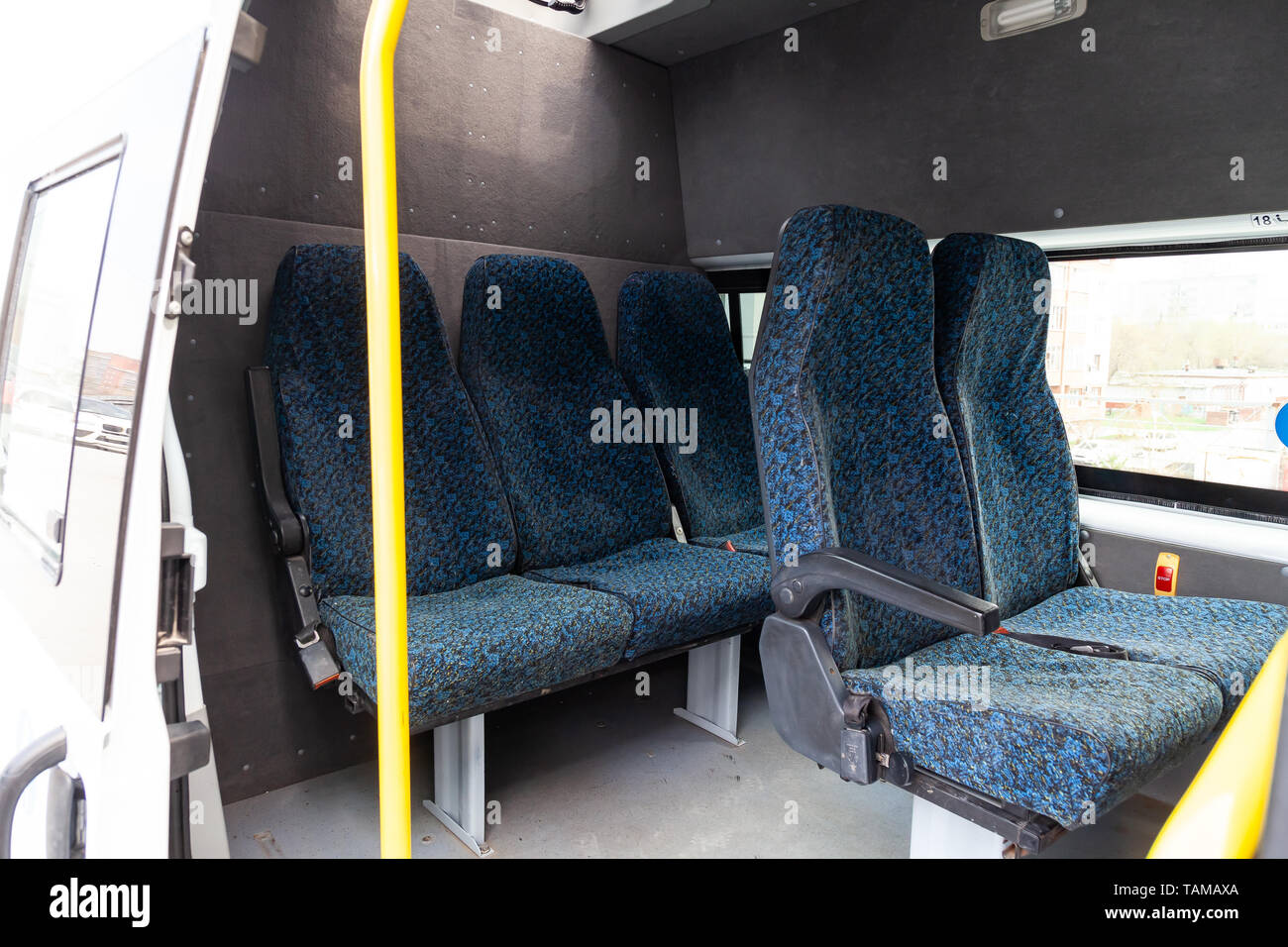 Five seats of a utility car in the back of a van with a partition ...