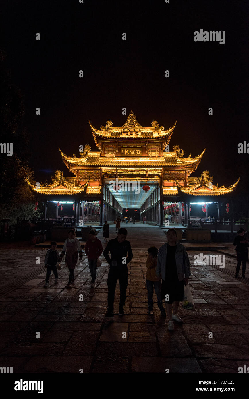 Night view of the ancient Chinese gate at Qintai Road historic district ...