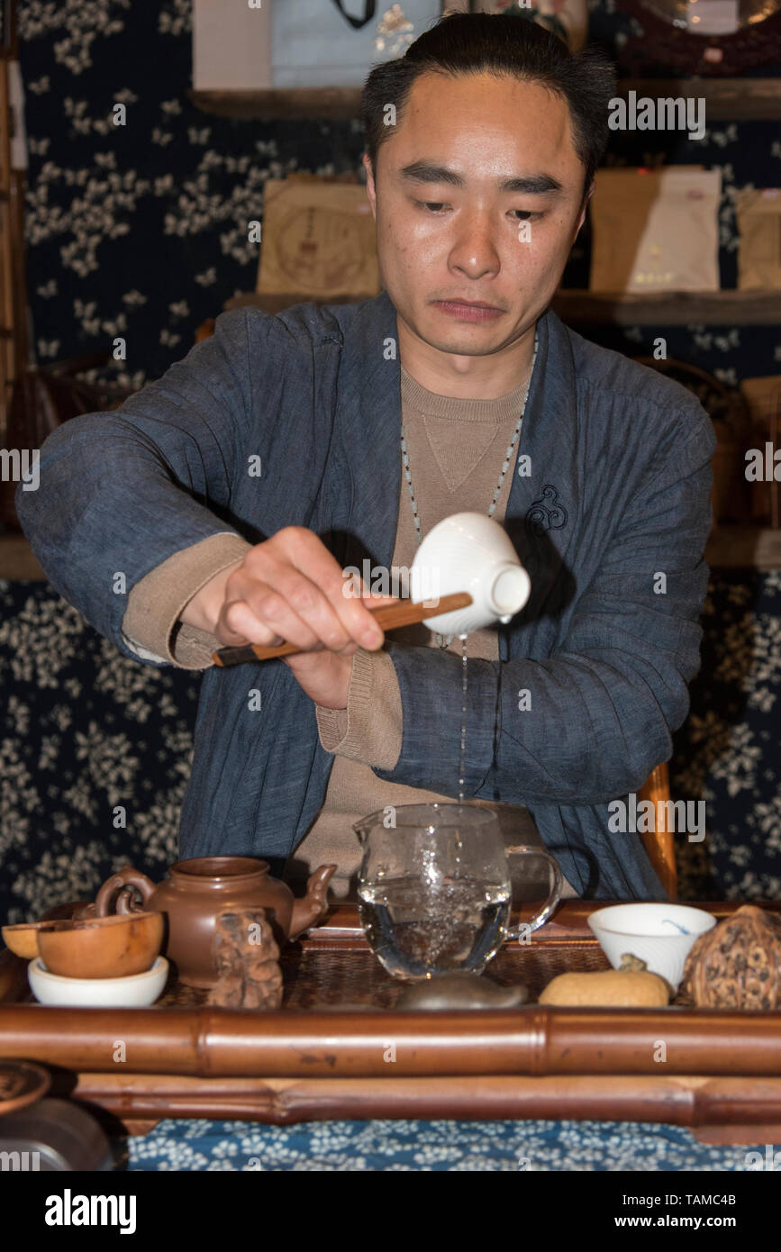 Chinese Tea Ceremony. Male server prepares the traditional tea ...