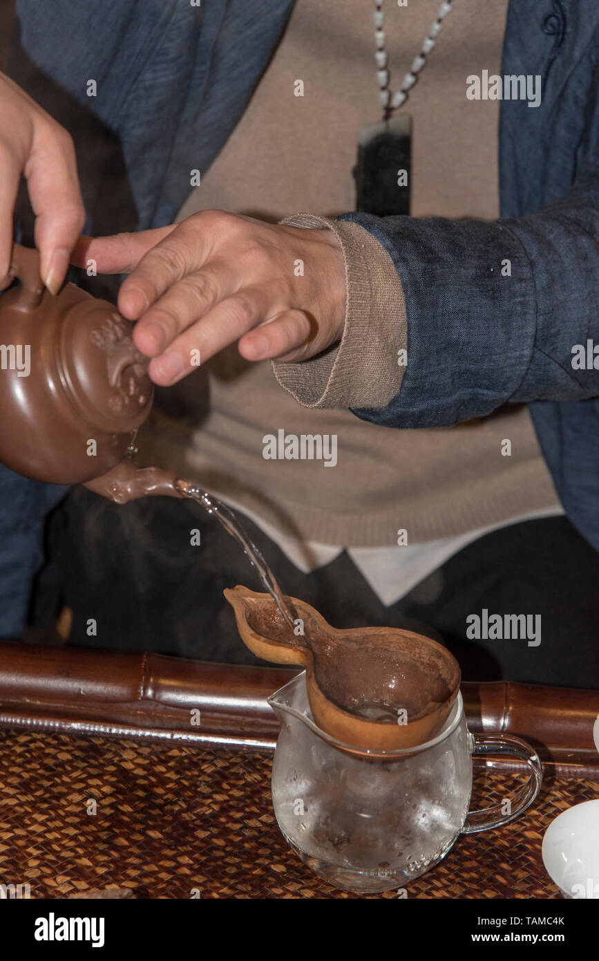 Chinese Tea Ceremony. Male server prepares the traditional tea ...