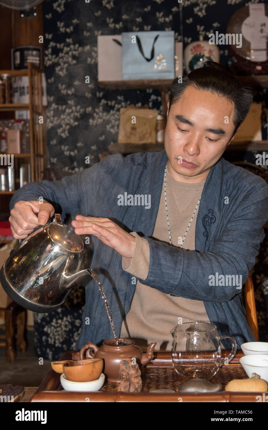 Chinese Tea Ceremony. Male server prepares the traditional tea ...