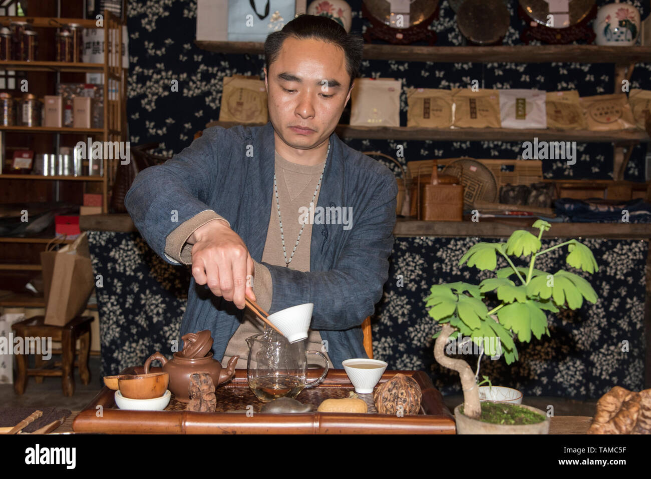 Chinese Tea Ceremony. Male server prepares the traditional tea ...