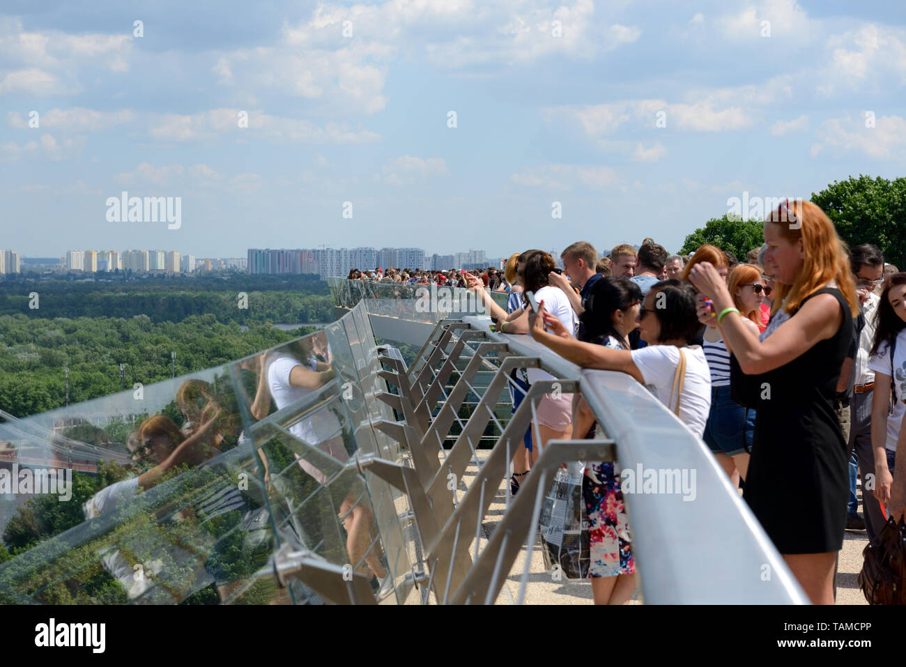 KYIV, UKRAINE - MAY 26: The group of people is on new pedestrian bridge ...