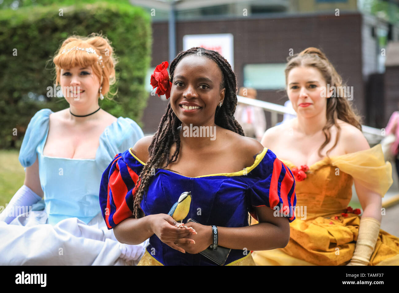 London, UK. 26th May, 2019. Three Disney Princesses on their way home ...