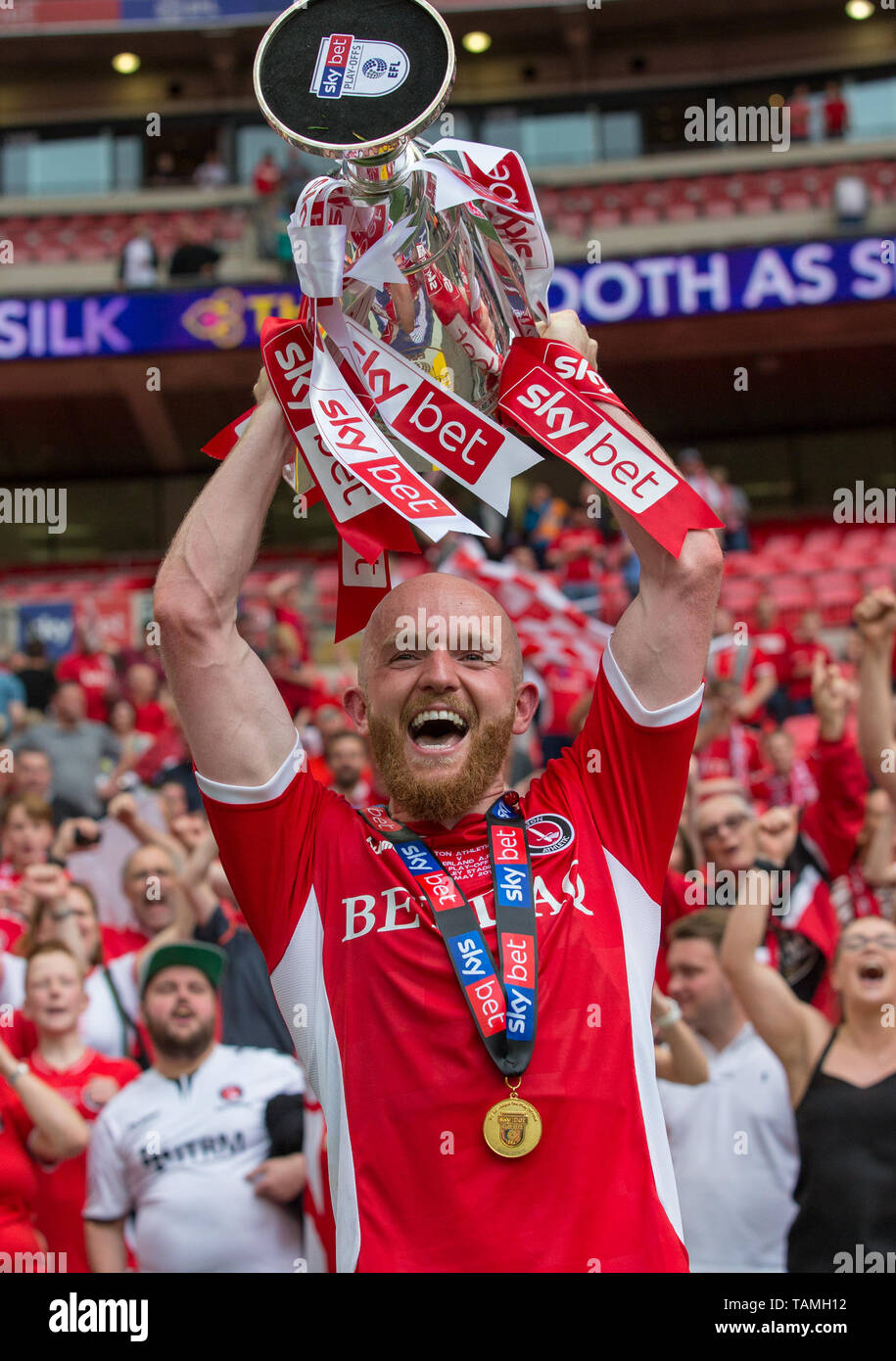 Jonathan Williams of Charlton Athletic celebrates with trophy during ...