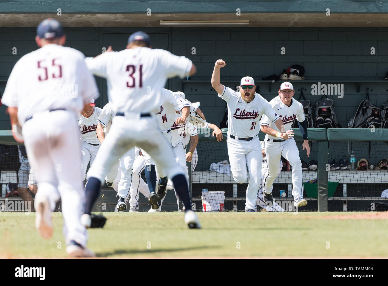 DeLand, FL, USA. 26th May, 2019. Liberty players storm the field after ...