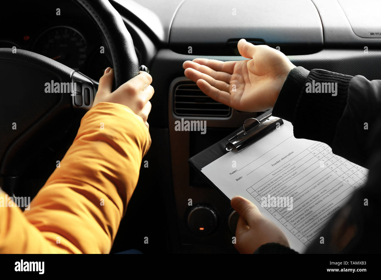 Young woman passing driving license test Stock Photo - Alamy