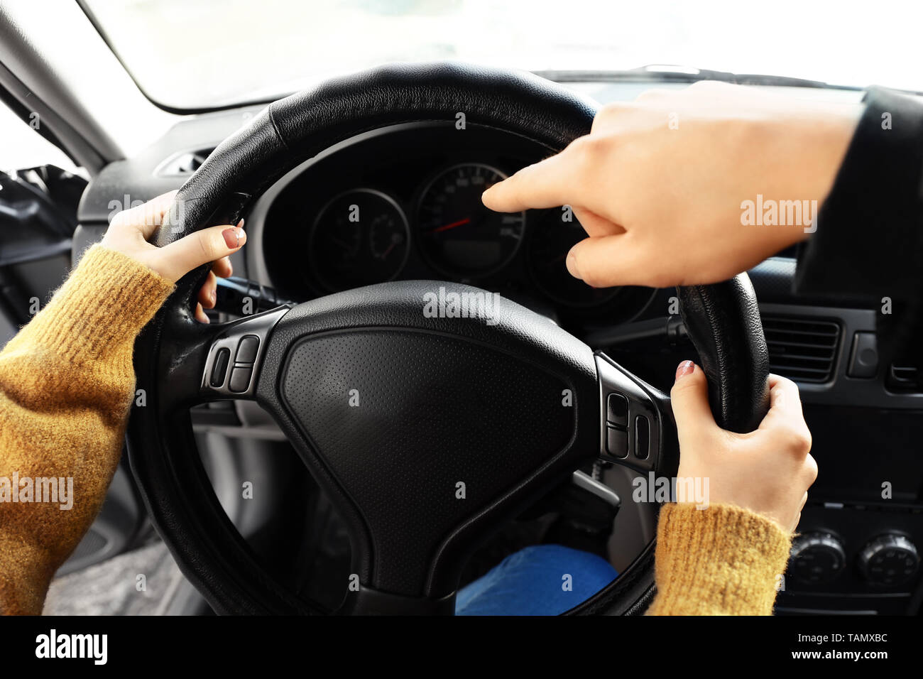 Young woman passing driving license test Stock Photo - Alamy