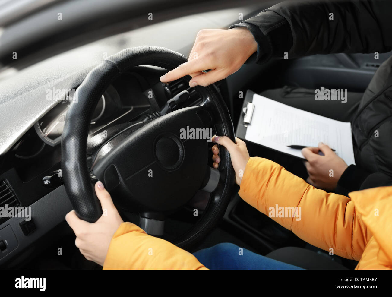 Young woman passing driving license test Stock Photo - Alamy