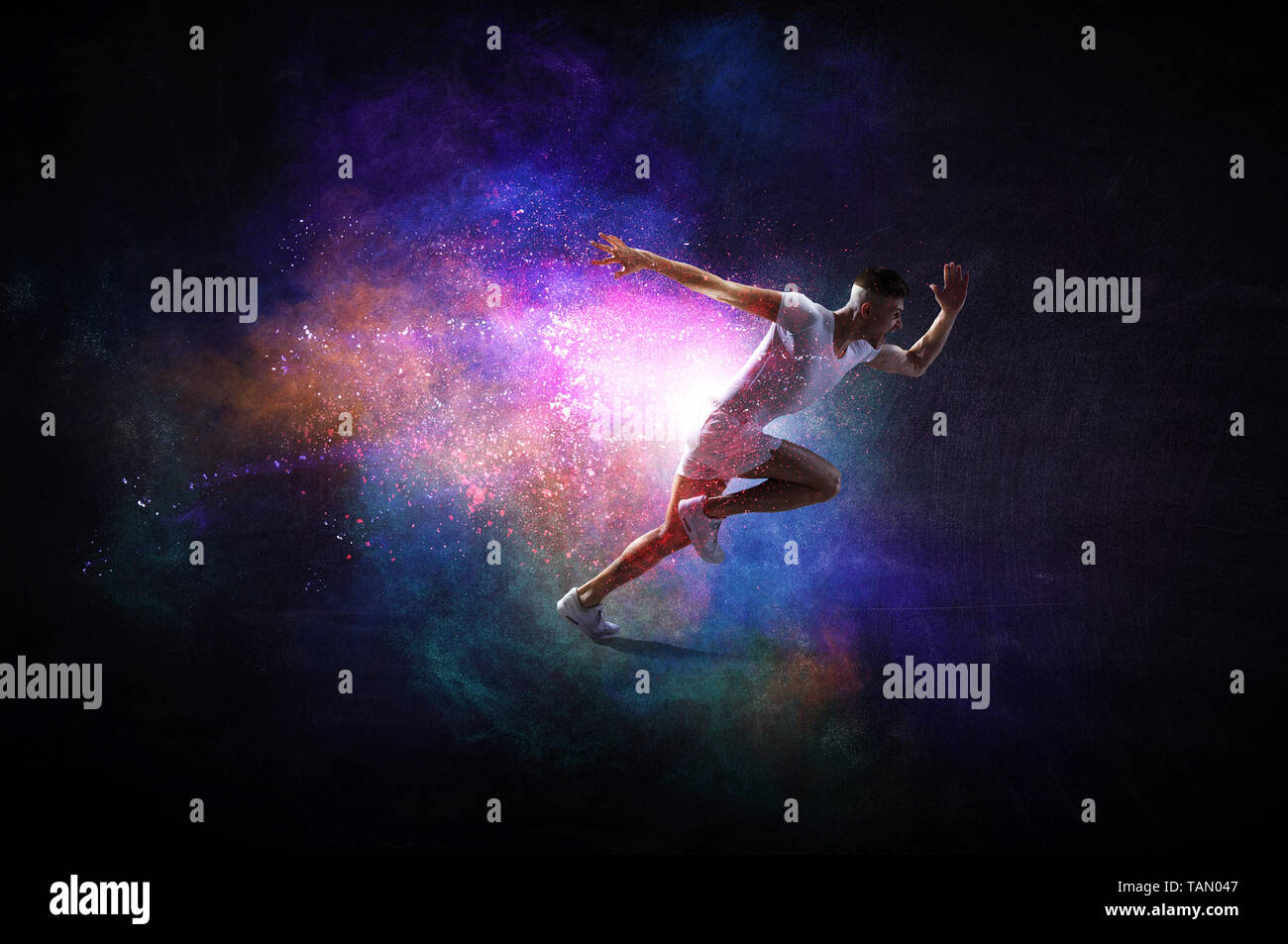 Fast running young man with colourful splashes background. Mixed media ...
