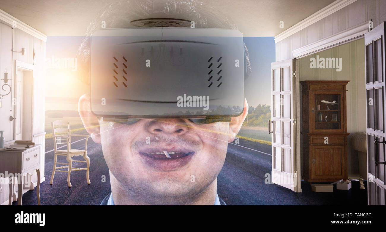 Portrait of a young man in VR helmet with a hall interior view on the ...