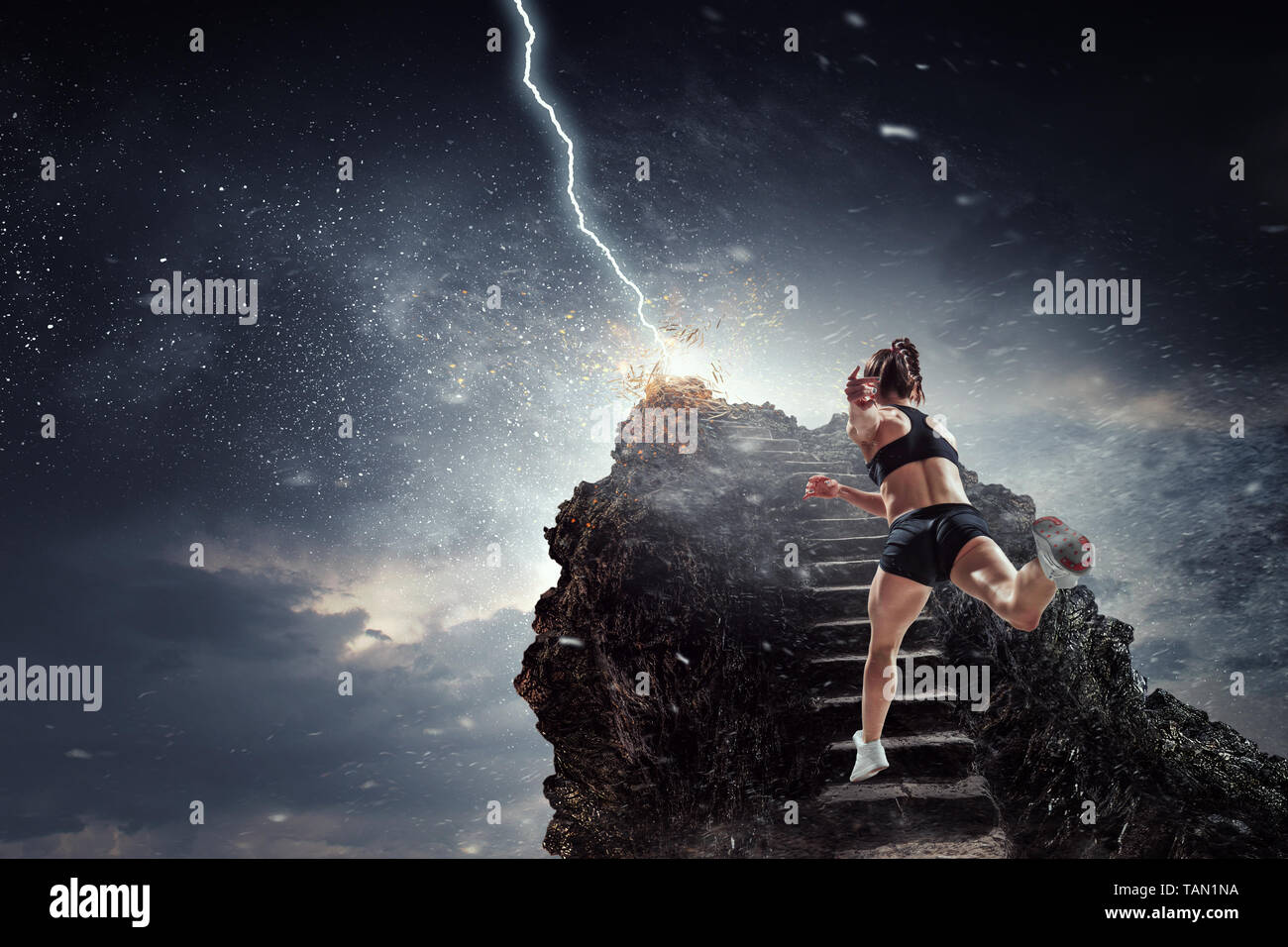 Sports woman running on stone ladder. Mixed media Stock Photo - Alamy