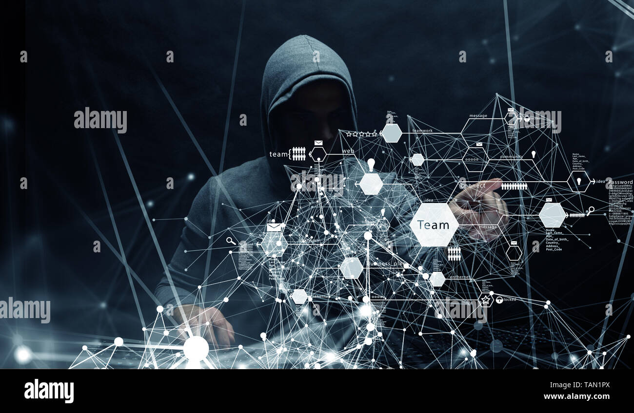 Hacker in hoodie dark theme Stock Photo - Alamy