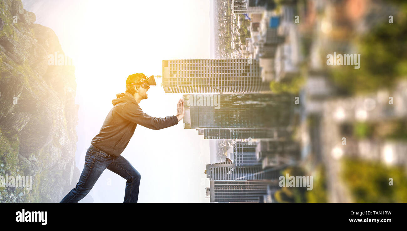 Virtual reality experience. Man in VR glasses Stock Photo - Alamy