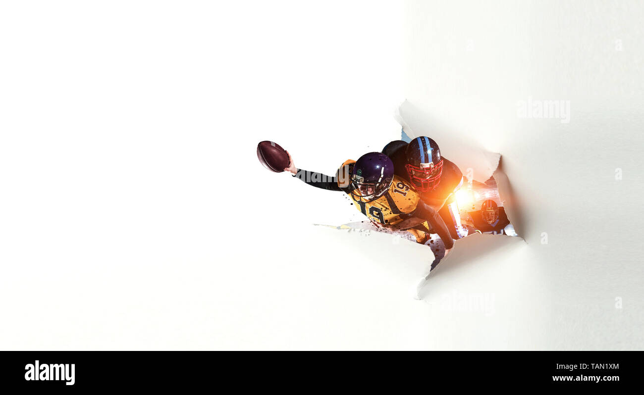 Paper breakthrough hole effect and american football Stock Photo - Alamy
