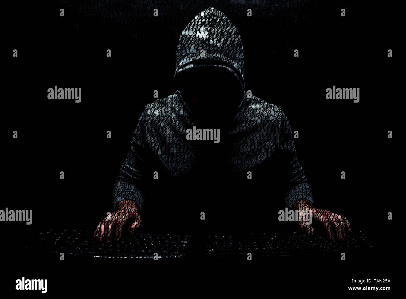Hacker in hoodie dark theme Stock Photo - Alamy
