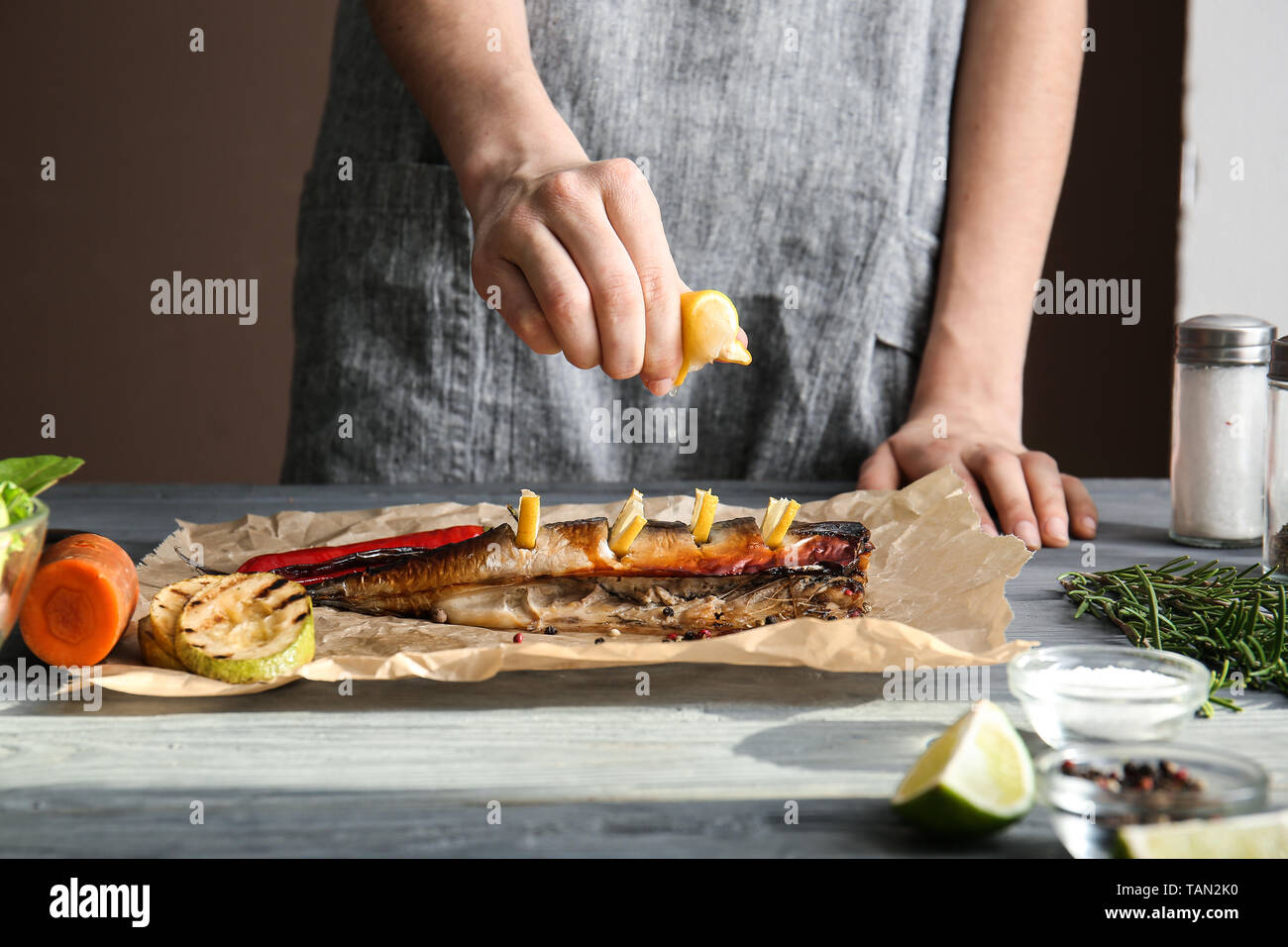 Squeezing lemon juice onto prepared hi-res stock photography and images ...