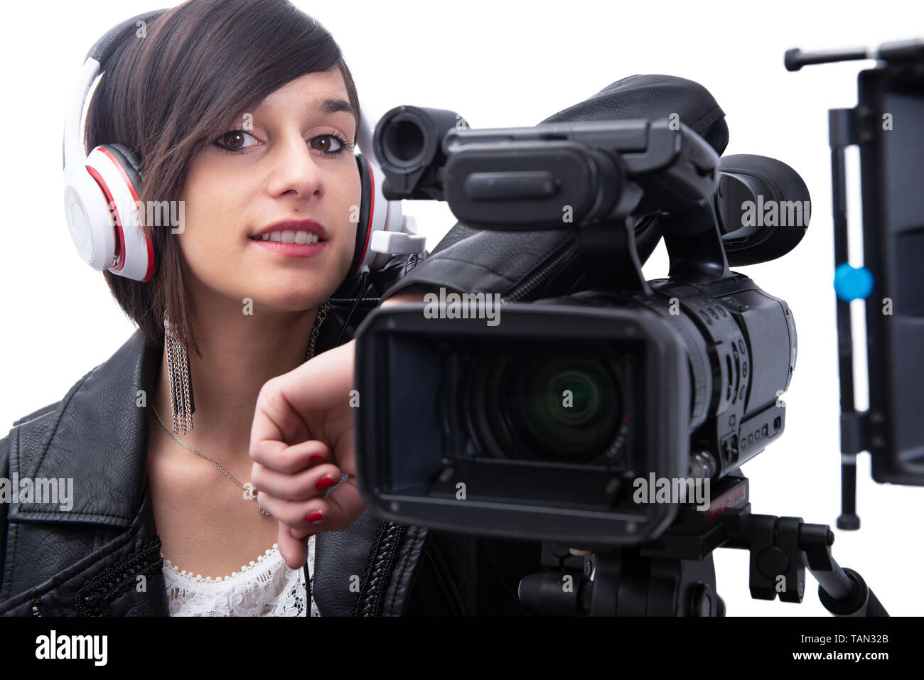young woman with professional video camera, isolated on white ...