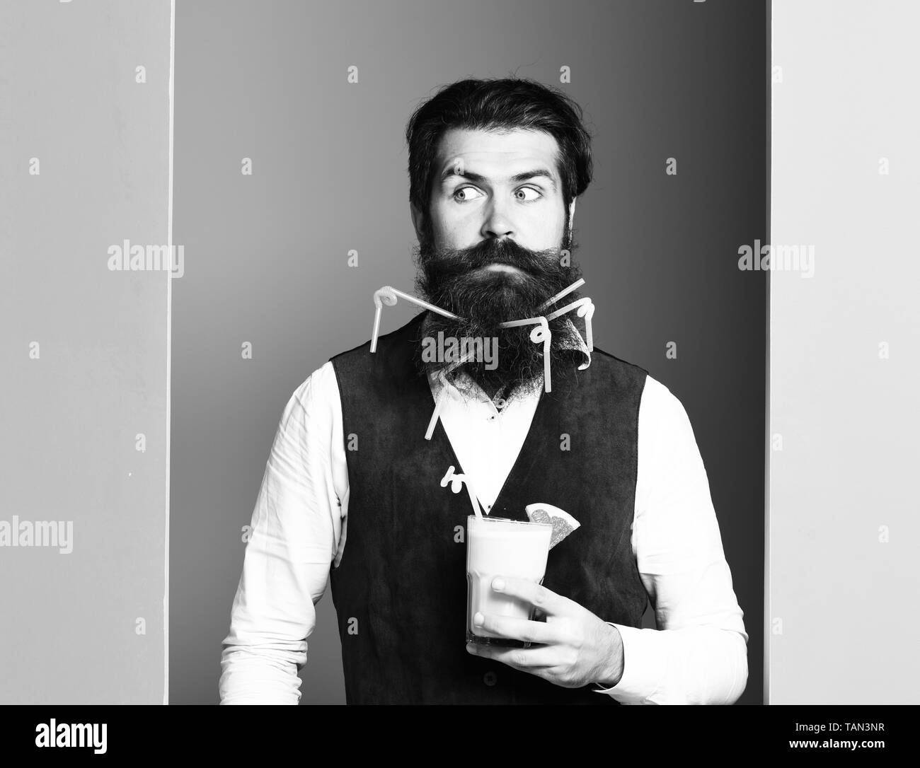 handsome bearded man with long beard and mustache has stylish hair on ...