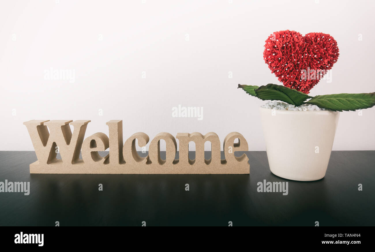 Welcome message wooden heart sign hi-res stock photography and images ...