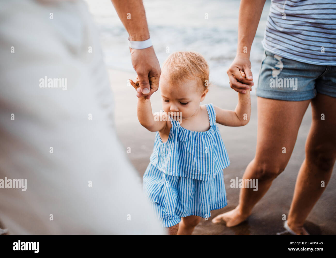 Parents toddler walking hi-res stock photography and images - Alamy