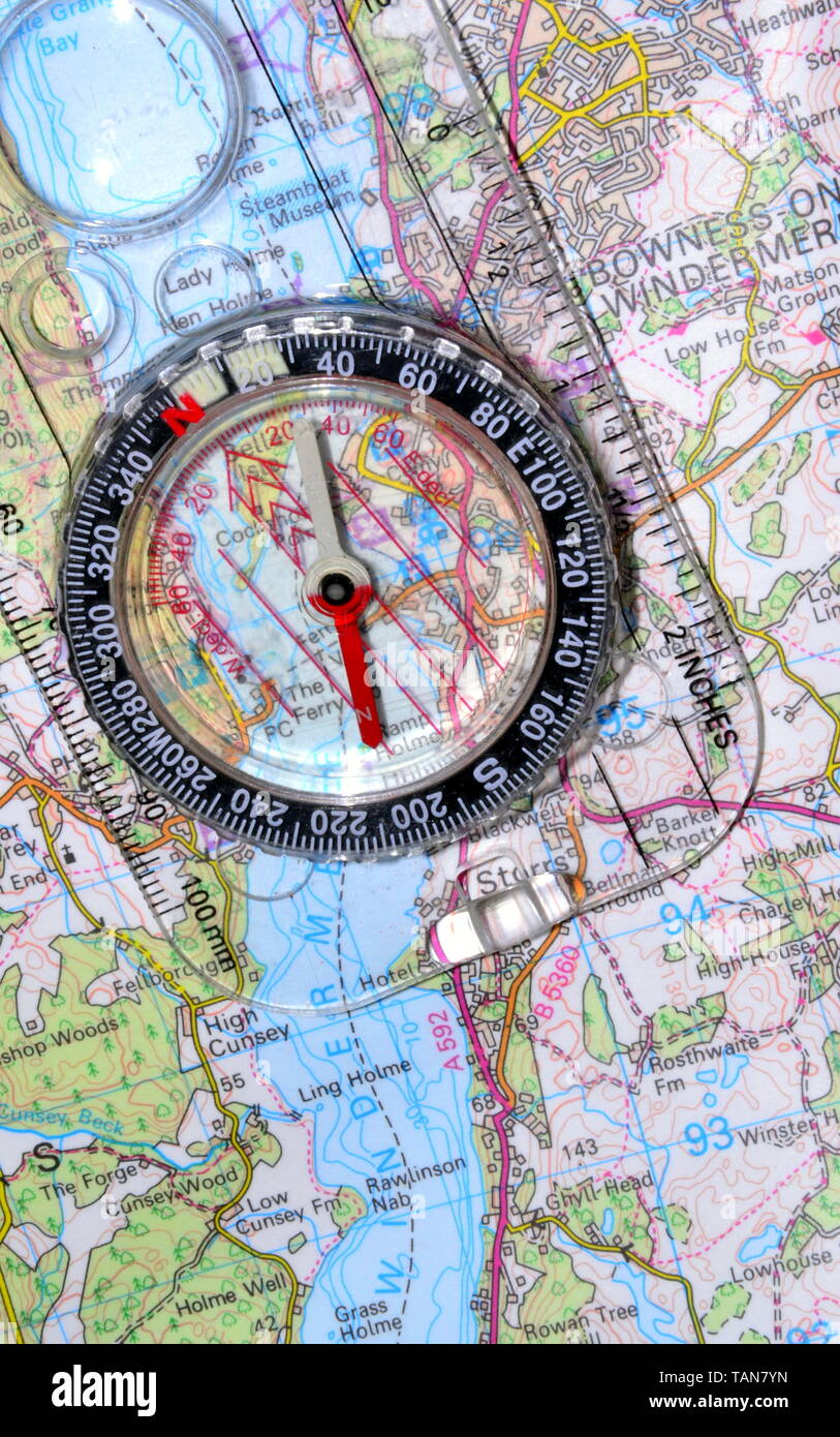 Compass on a map of the Bowness in Windermere area Stock Photo - Alamy