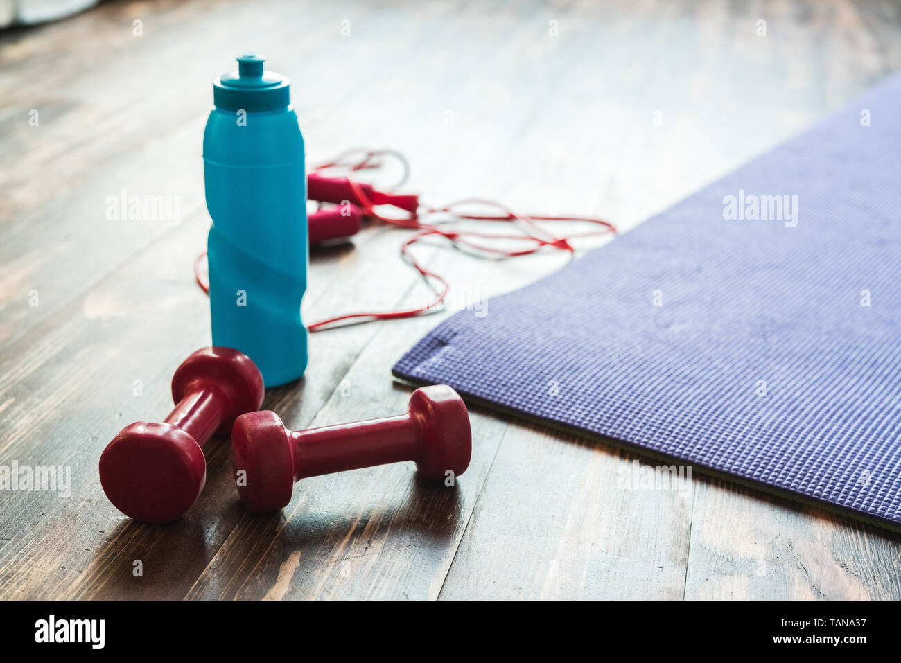 Sport equipment isolated on wooden floor at home healthy lifestyle ...