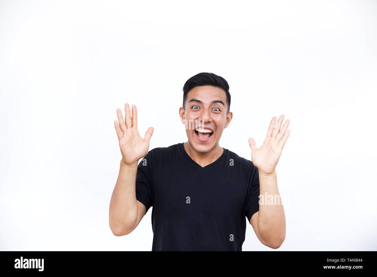 Handsome hispanic man happy and excited expressing surprise, energy and ...