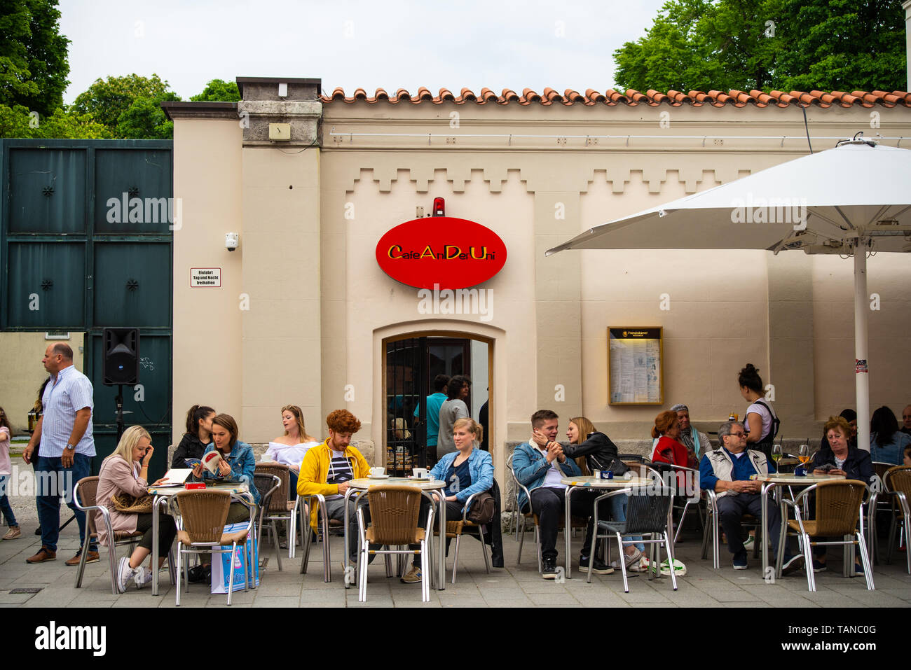 Munich,Germany- May 25,2019: People sit outside the landmark Cafe an ...