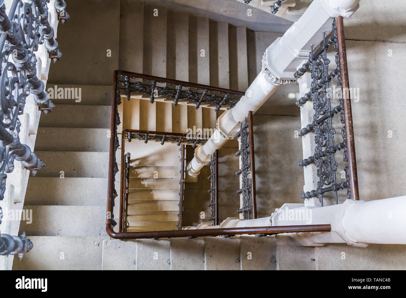 Top view to old castle indoor stair with wood handrail Stock Photo - Alamy