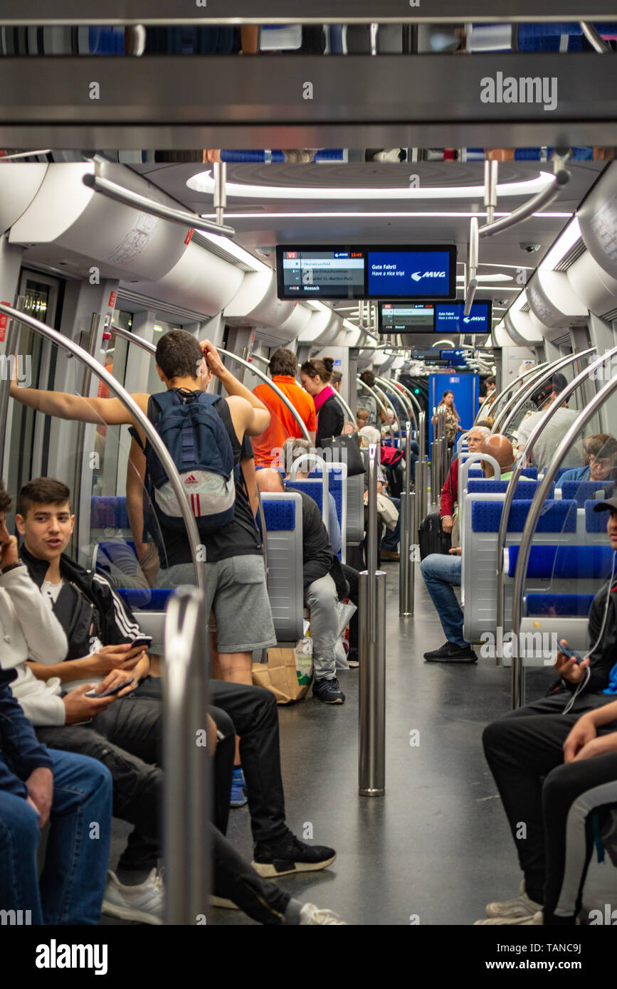 Munich,Germany- May 25,2019: Passengers talk to each other in a subway ...