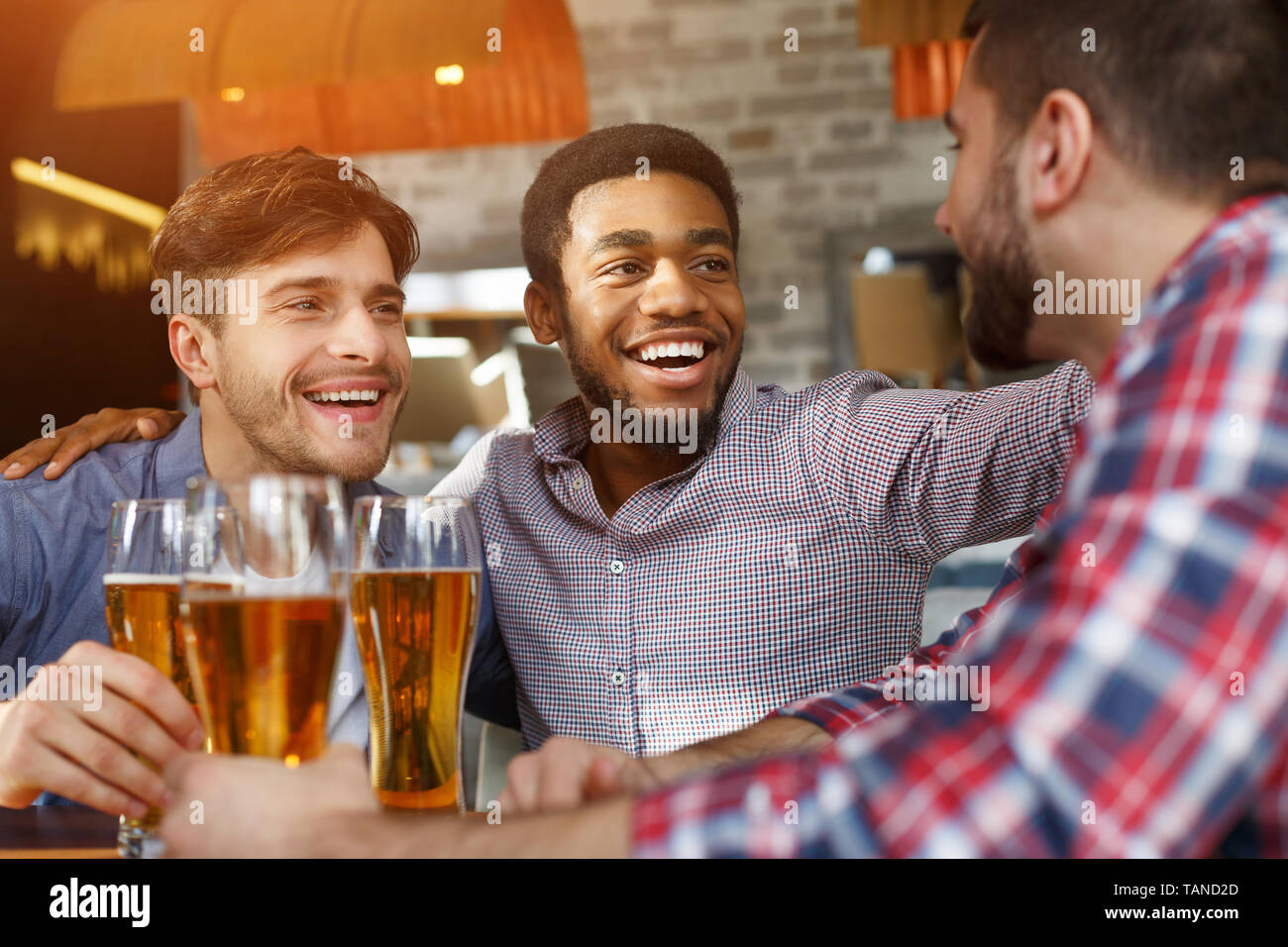 Long-Awaited Meeting. Best Friends Drinking Beer In Bar Stock Photo - Alamy