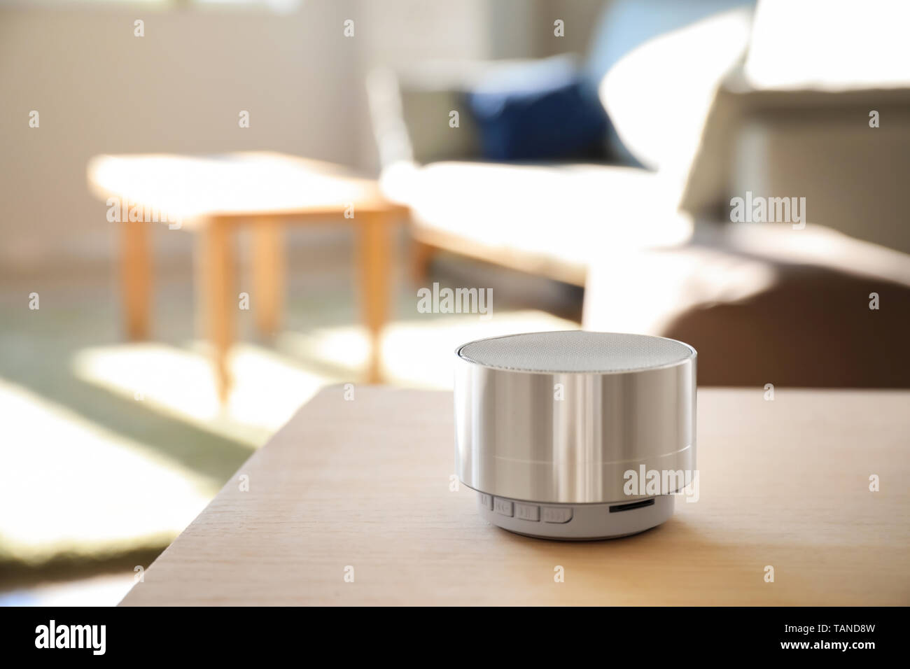 Smart home assistant device on table in room Stock Photo - Alamy