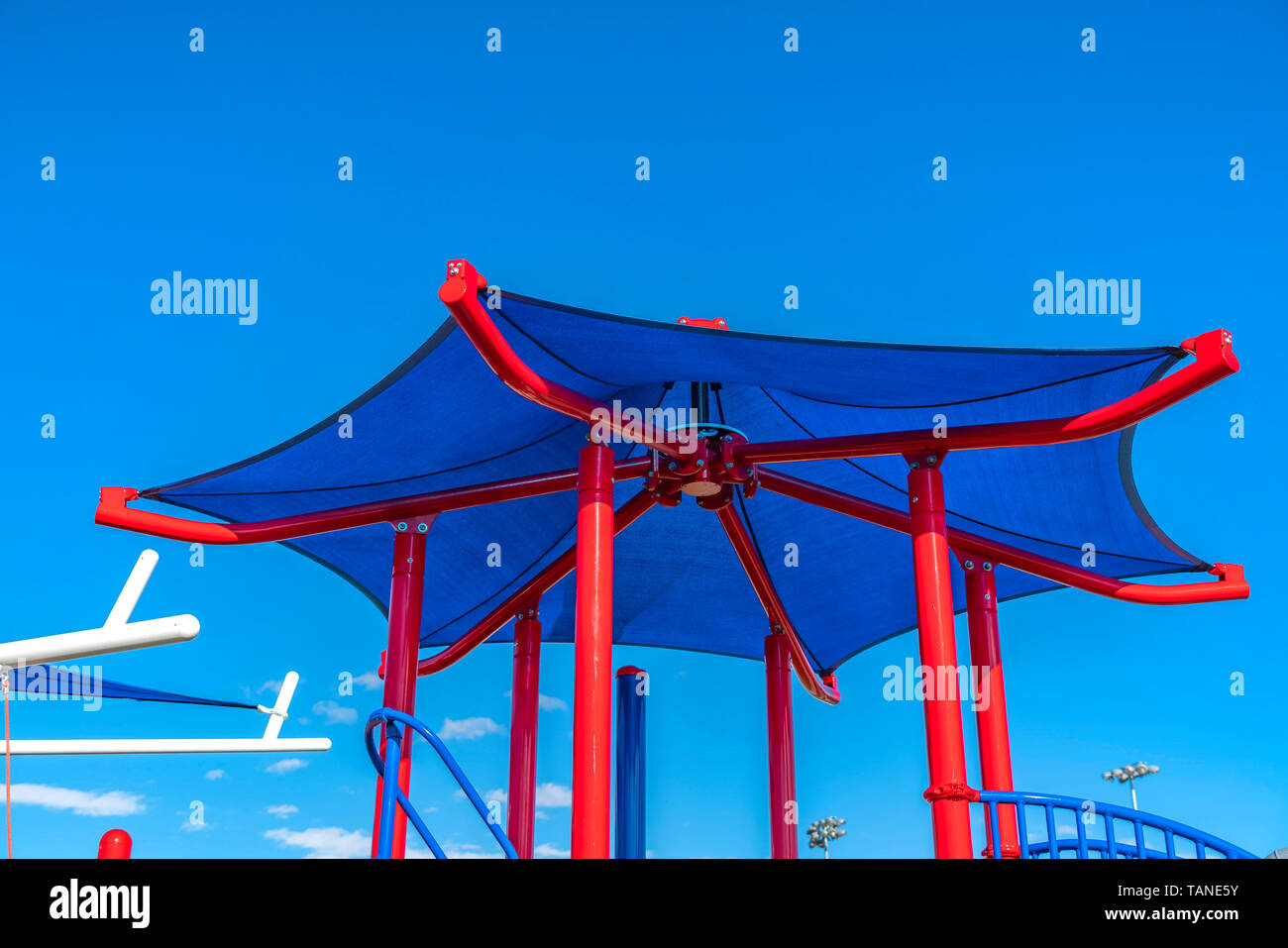 Tower of a playground equipment against vivid blue sky on a sunny day ...