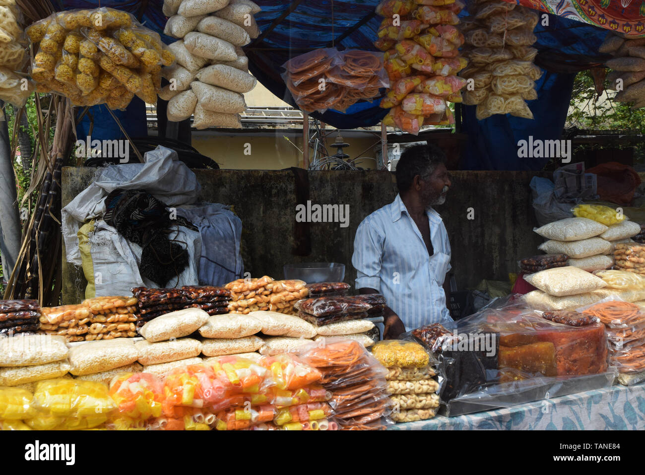 market stall selling sweets and snacks, kerala, india Stock Photo - Alamy