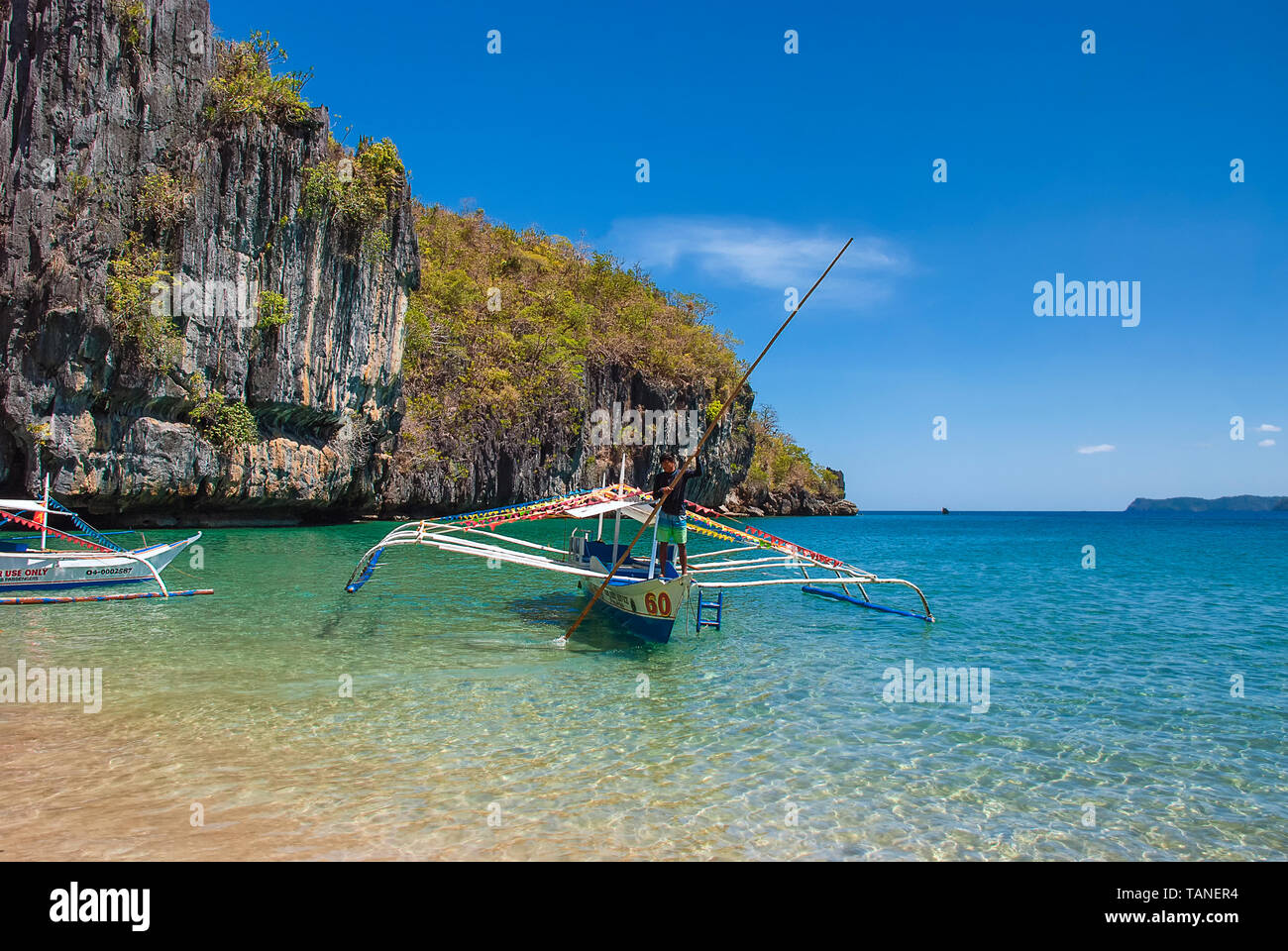 Motorised outrigger boats on the island of Palawan in the Philippines ...