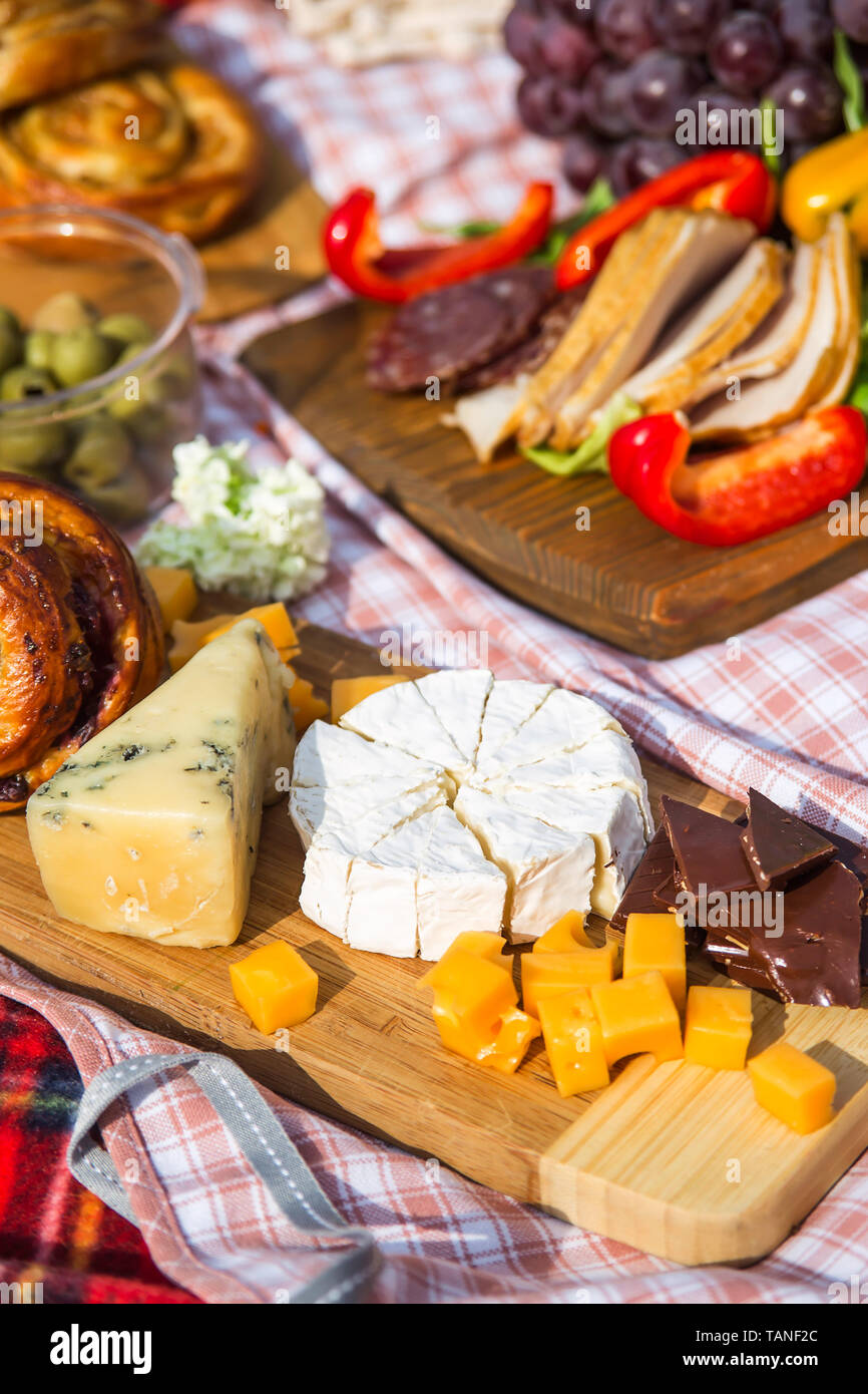 Beautiful delicious picnic food chopped cheese of different types on ...