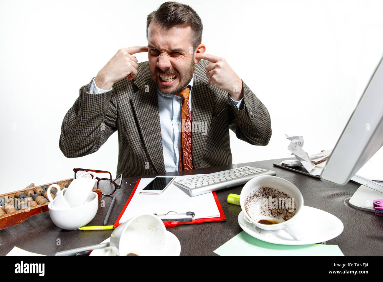 Voices in his head. Young man suffering from the colleagues' talks in ...