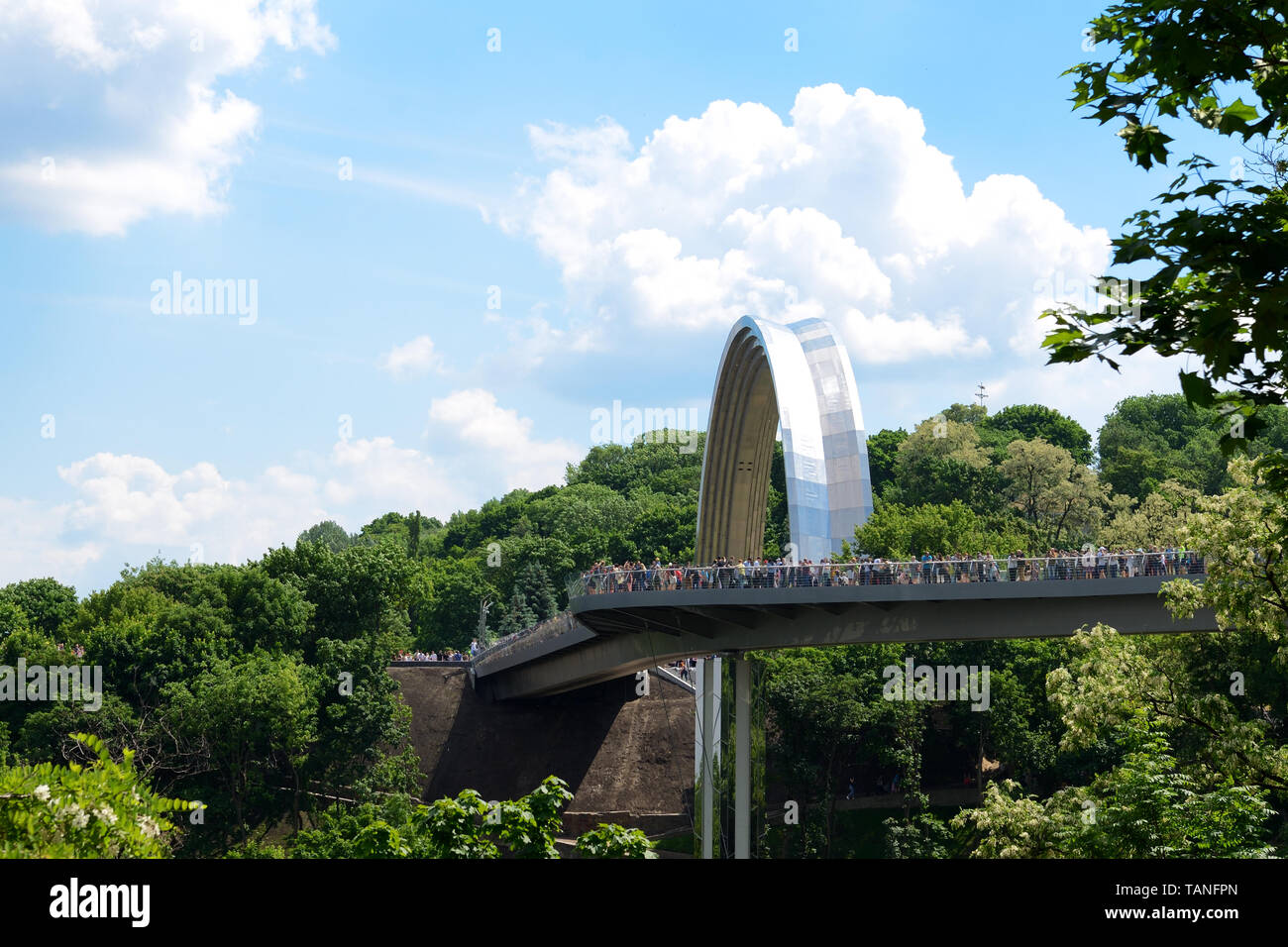 KYIV, UKRAINE - MAY 26: The group of people is on new pedestrian bridge ...
