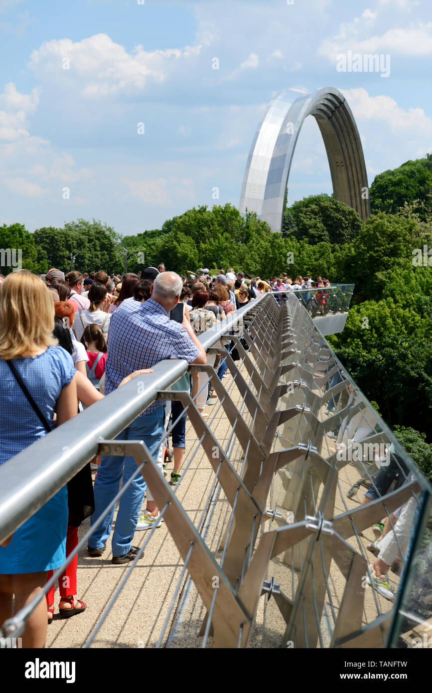 KYIV, UKRAINE - MAY 26: The group of people is on new pedestrian bridge ...