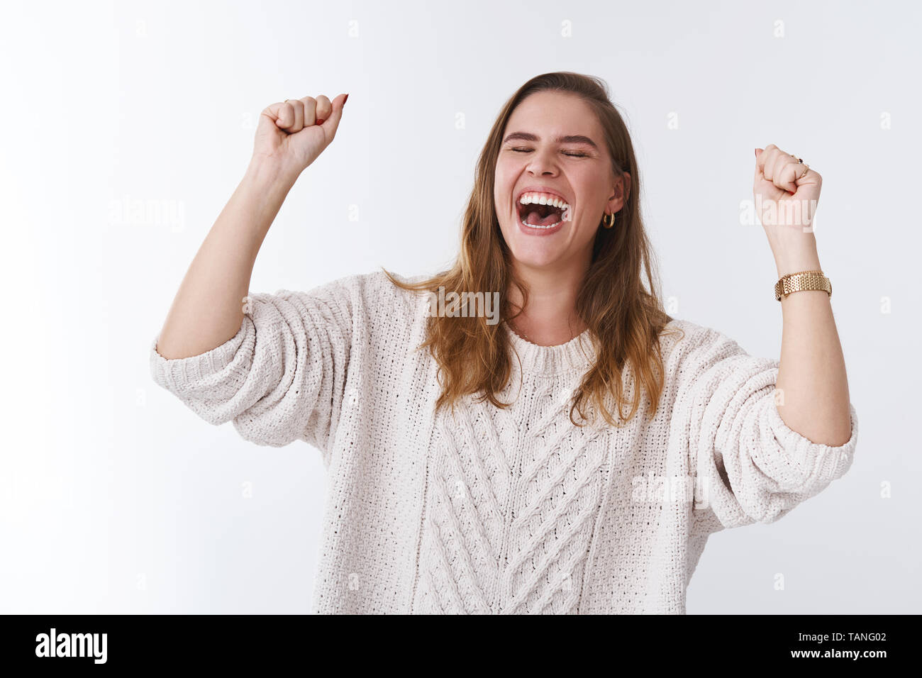 Sweet taste victory. Portrait very happy attractive celebrating young ...