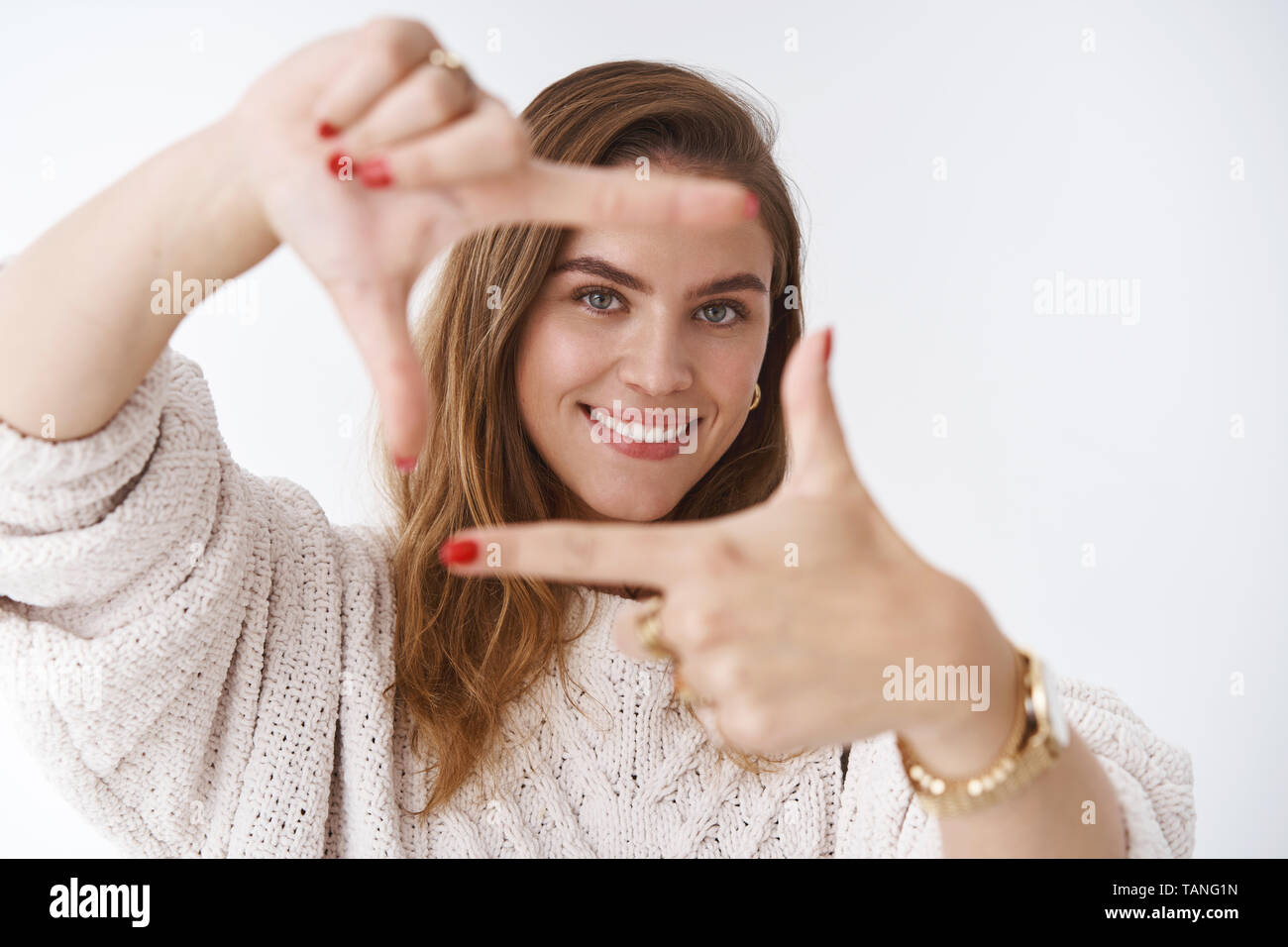 Creative good-looking woman using imagination picturing new appartment ...