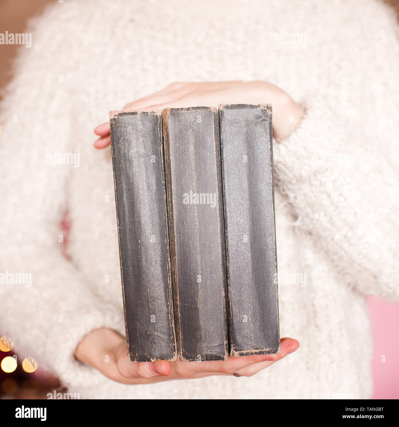 Girl holding stack paper hi-res stock photography and images - Alamy