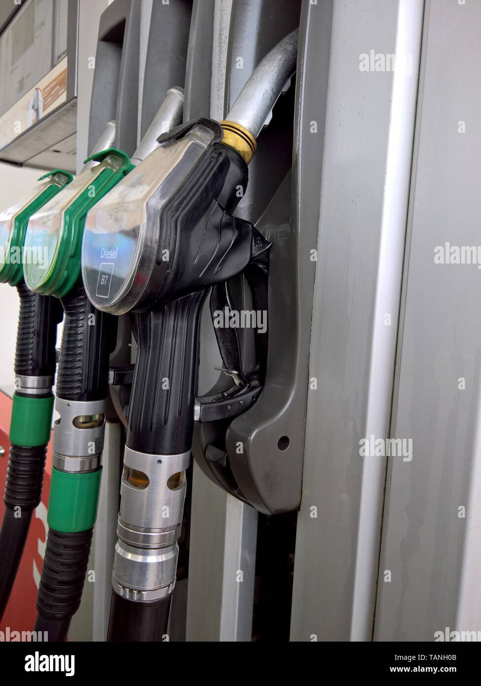 Fuel guns at gas station with petrol and diesel fuel for automobile ...