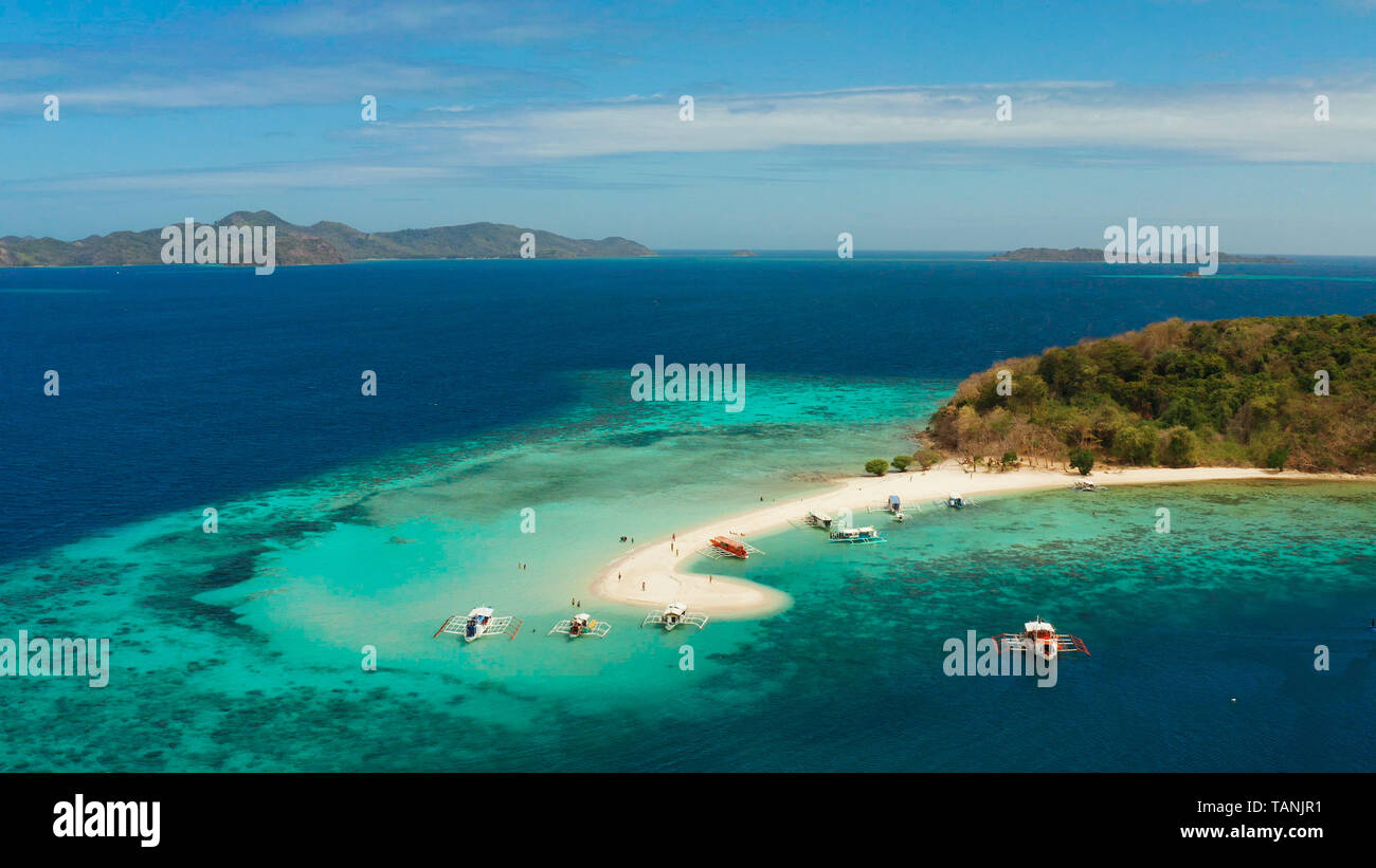 aerial seascape tropical island with sand bar, turquoise water and ...