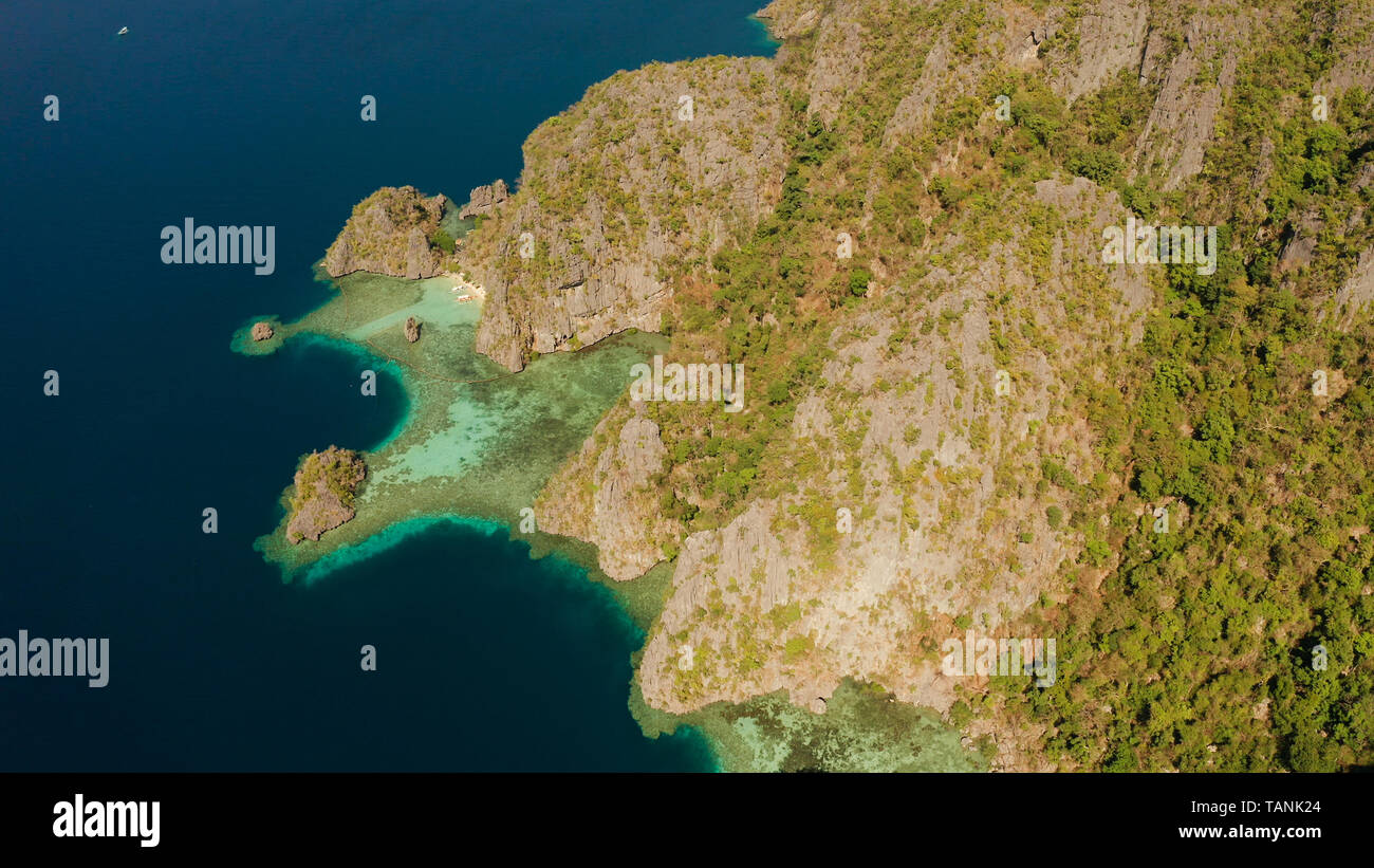 blue lagoons and cliffs of tropical mountain island. aerial view ...