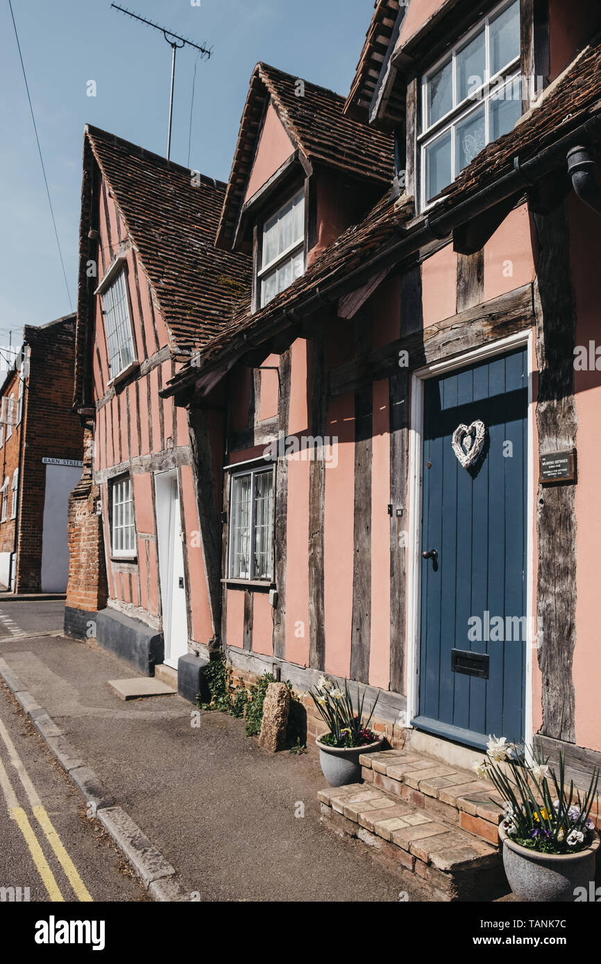 Lavenham, UK - April 19, 2019: Facades of pastel pink cottages in ...