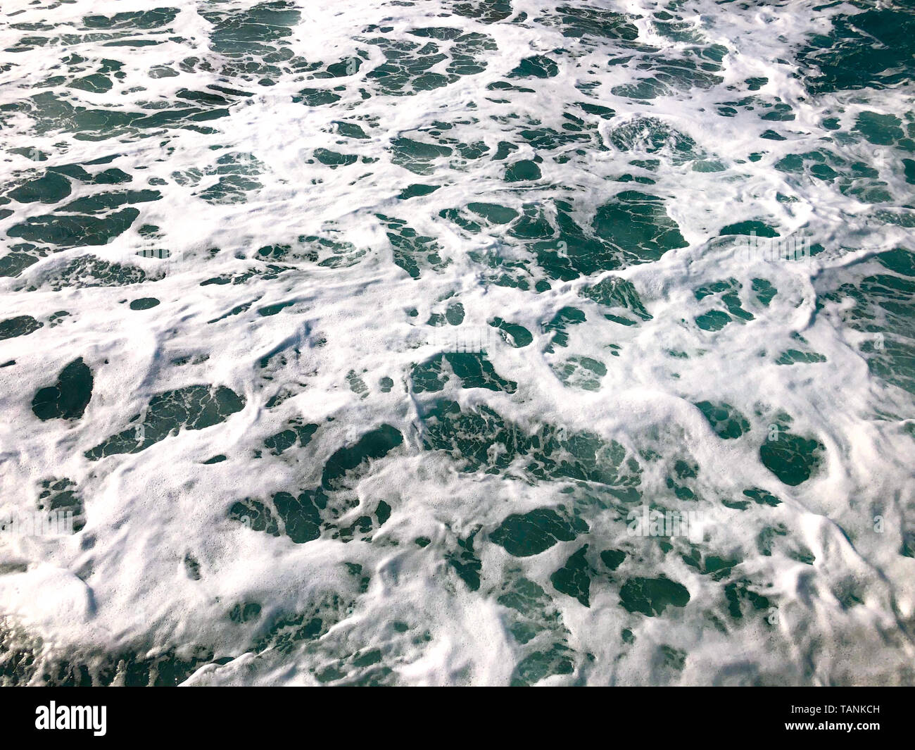 Restless movement of foam waves. Background of water in the sea Stock ...